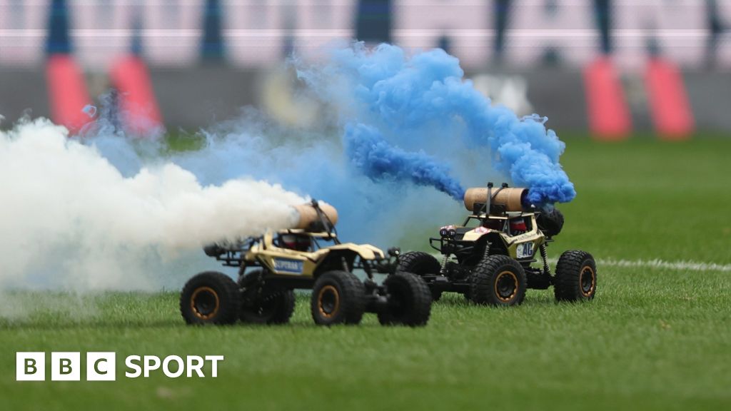 Bundesliga 2: Remote control cars with smoke bombs halt Hansa Rostock v ...