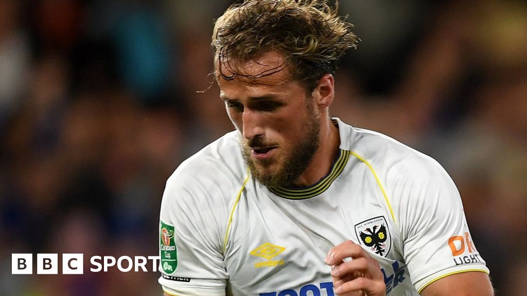 Joe Lewis: AFC Wimbledon sign Stockport defender on permanent deal ...