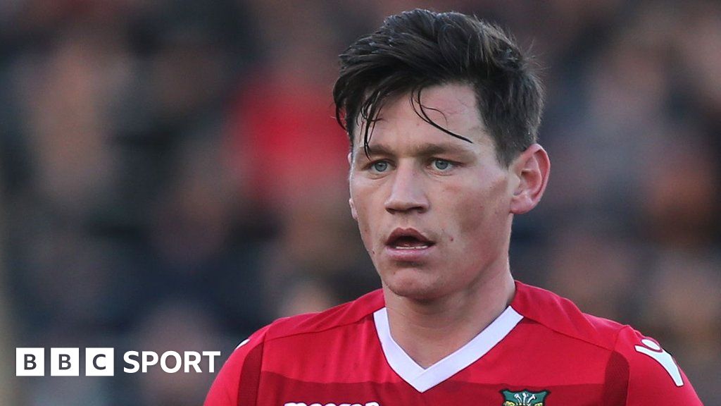James Jennings: Defender signs new one-year Wrexham deal - BBC Sport