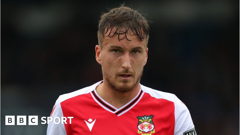 Luke Young: Wrexham captain has contract extended 12 months - BBC Sport