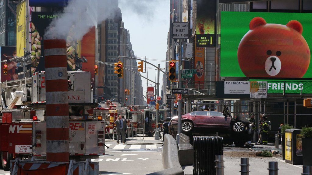Woman killed and 22 injured as car hits Times Square crowd - BBC News