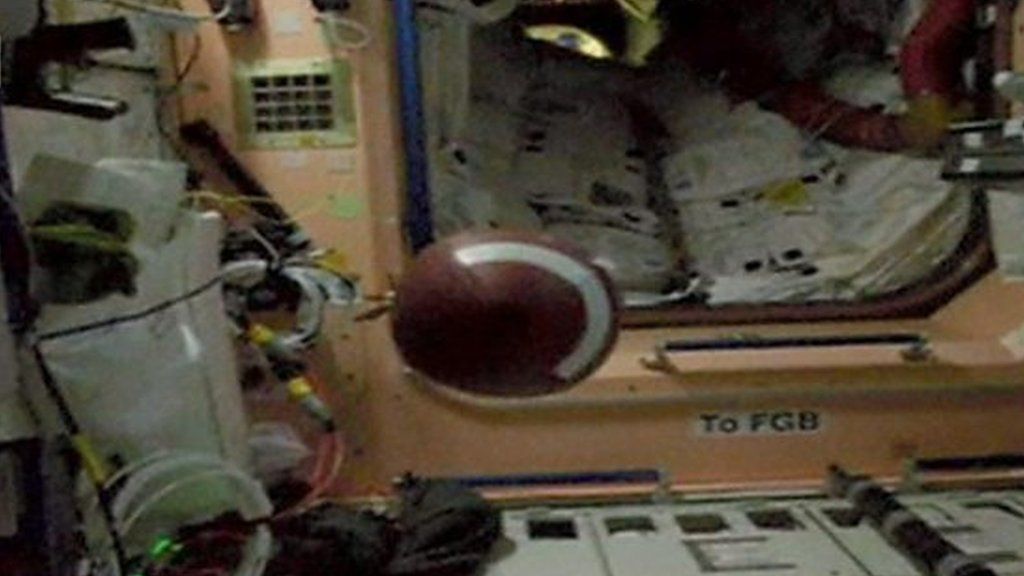 Astronauts on the ISS "throw" football 285,000 miles - BBC Newsround