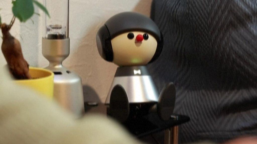 Meet the robots helping to tackle loneliness in Japan - BBC Newsround