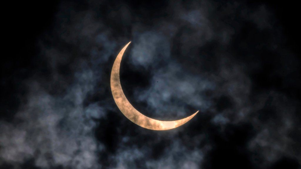 In pictures: Rare solar eclipse darkens Asia on the summer solstice ...