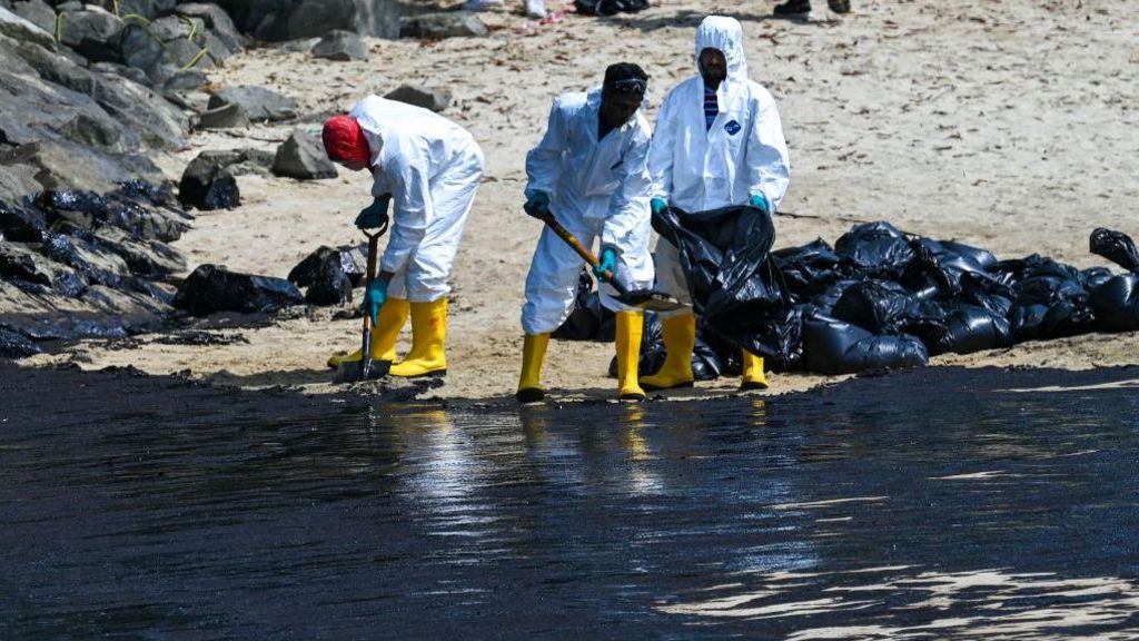 Singapore oil spill: Clean-up in place after beaches turn black - BBC ...