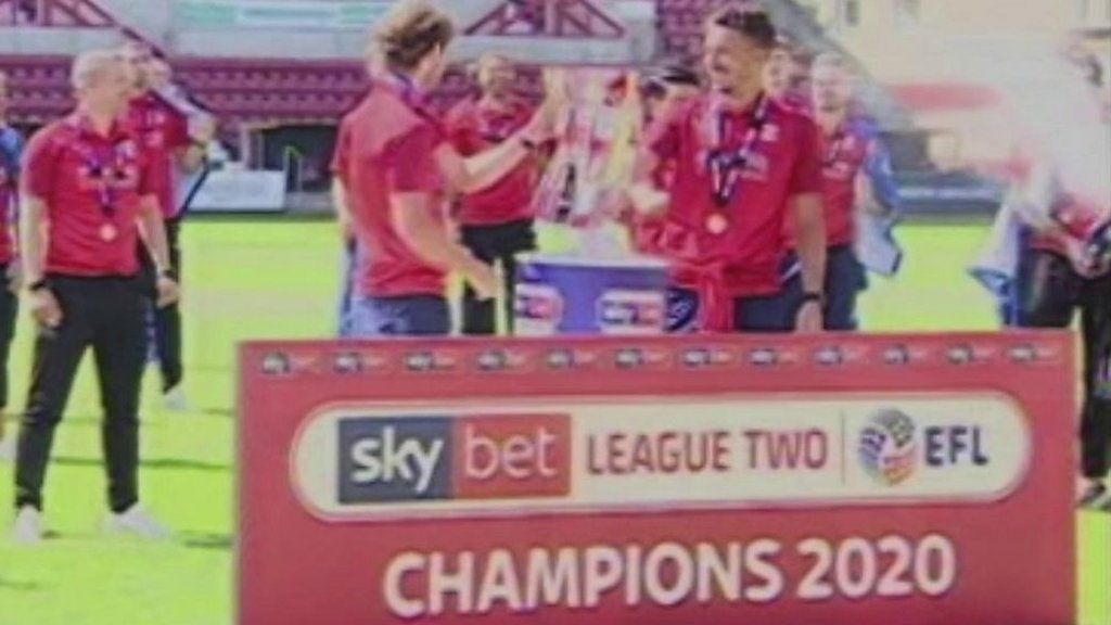 Swindon Town: League Two champions lift trophy at empty County Ground ...