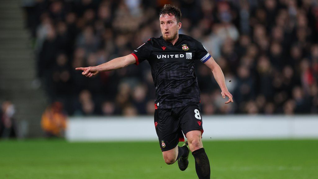 Luke Young: Skipper focused on Wrexham success after milestone - BBC Sport