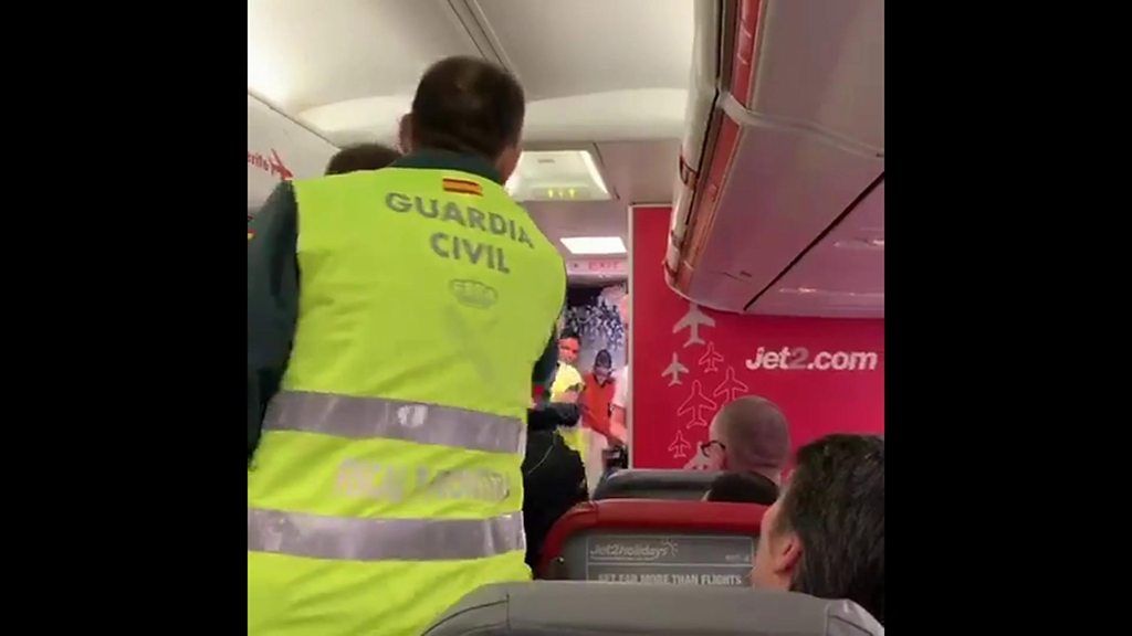 Jet2 apologises after 'disruptive passengers' cause delay - BBC News