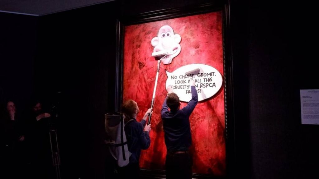 Animal-rights protesters attack portrait of King - BBC News
