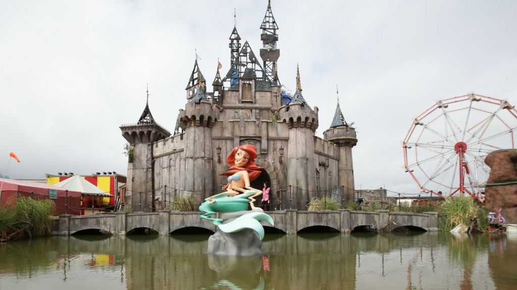 Banksy Dismaland 'theme park' opens in Weston-super-Mare - BBC Newsround