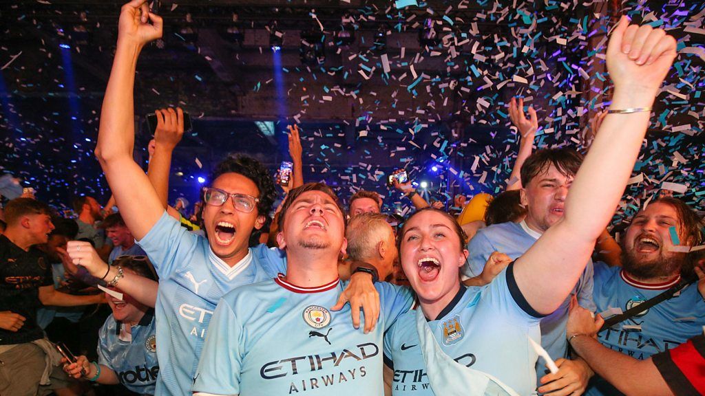 Manchester City fans celebrate historic Treble win - BBC News