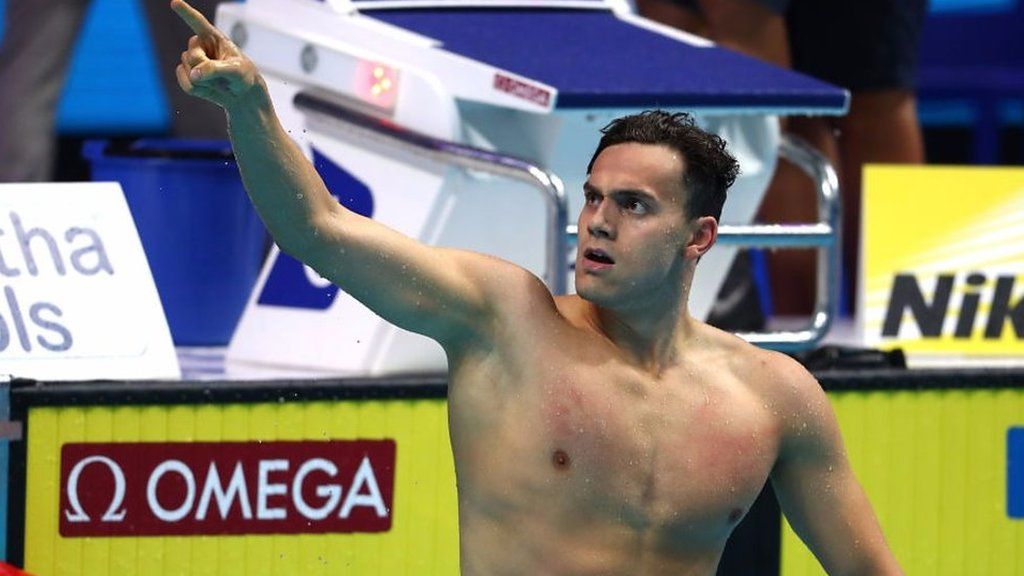 World Swimming Championships: Britain come from third to defend relay ...