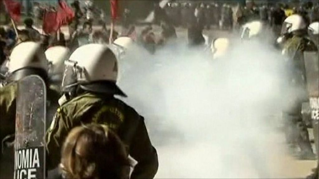 Greek PM to go ahead with austerity plans amid protests - BBC News