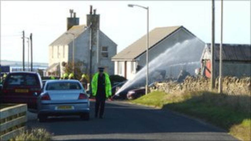 Man held after residents flee Orkney fires - BBC News