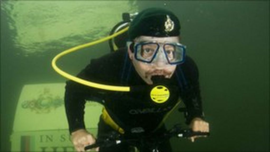 Surrey firefighter in underwater cycle challenge - BBC News