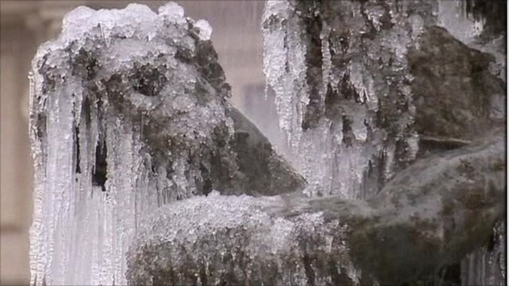 Rome's fountains covered in ice amid freezing weather - BBC News