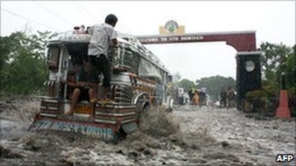 Philippine floods kill two and displace thousands - BBC News
