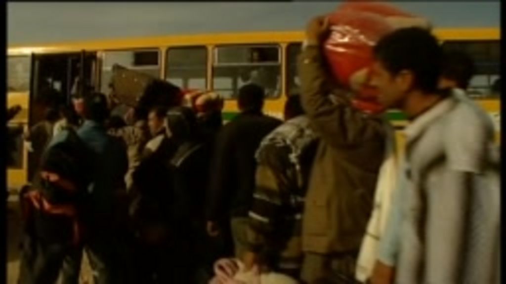 On board a bus fleeing Libya's growing humanitarian crisis - BBC News