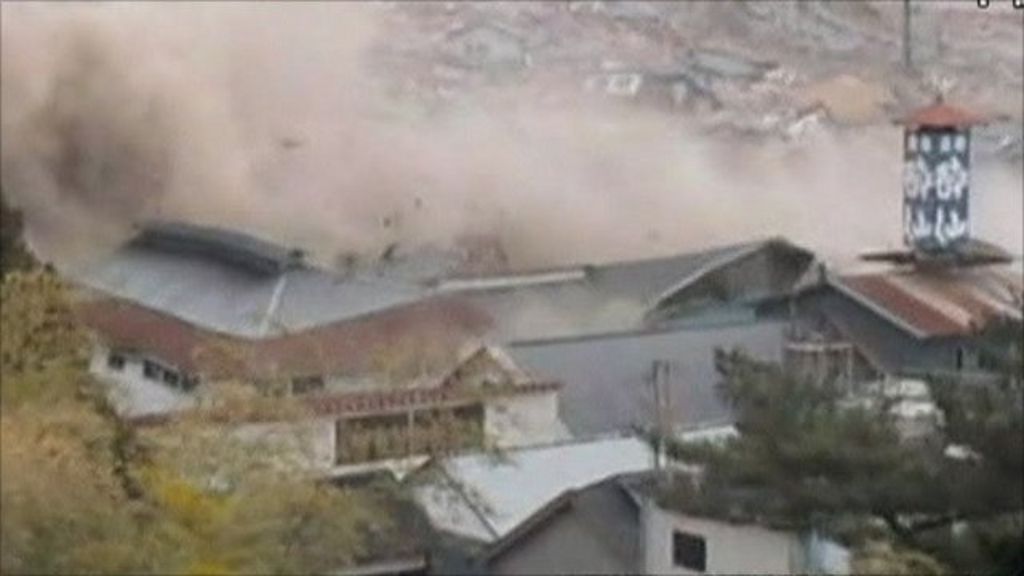 Japan earthquake: Tsunami surge destroys settlement - BBC News