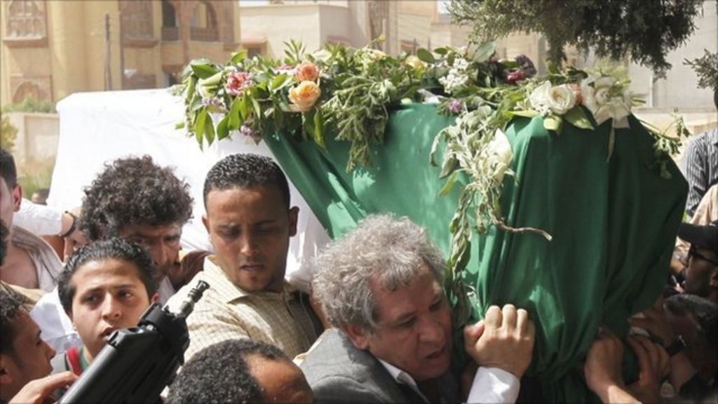 Libya: Funeral held for Gaddafi's son - BBC News