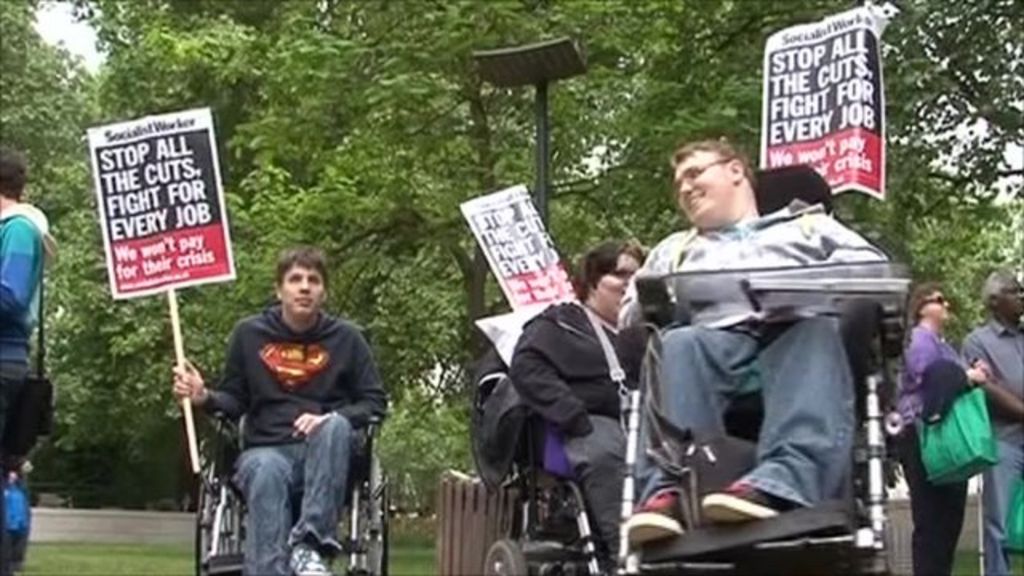 Disabled people stage protest over spending cuts - BBC News
