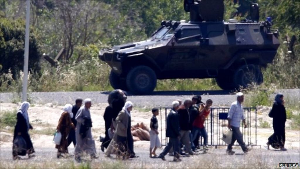 Syria: Refugees flee border camps as troops deploy - BBC News