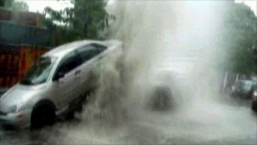 Car thrown into the air by exploding manhole in Montreal - BBC News