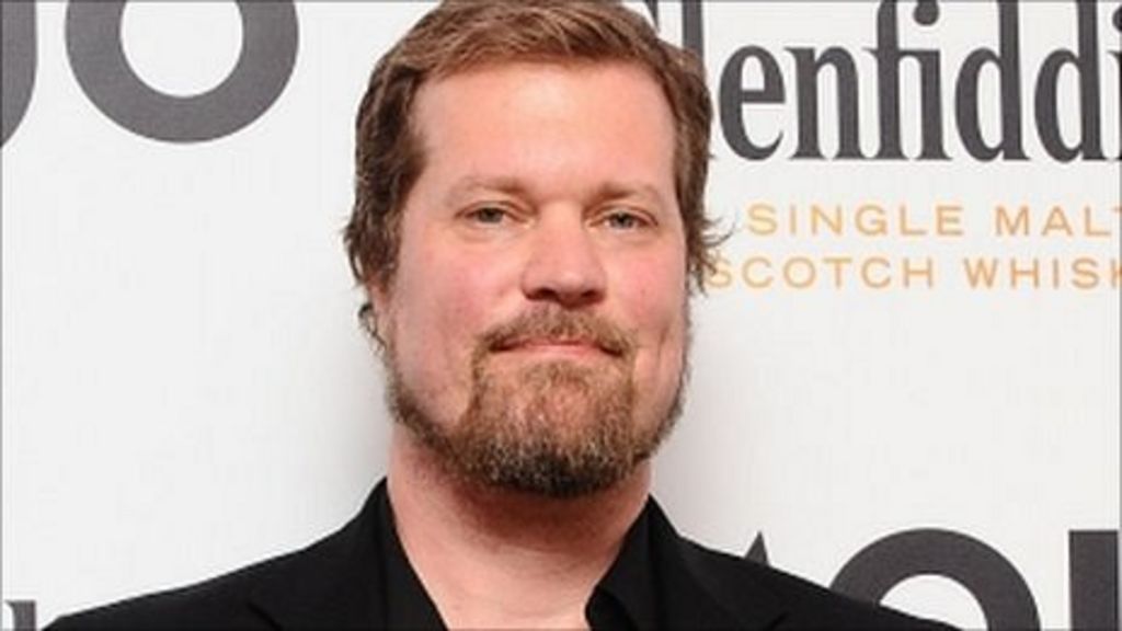 Singer John Grant uses newspaper as identity for passport - BBC News