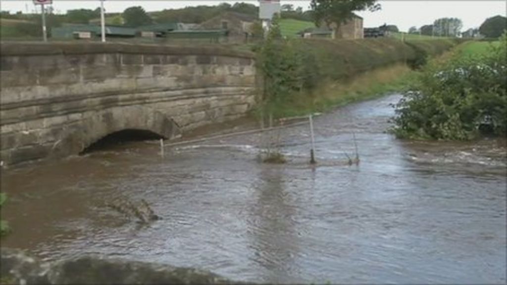 Flooding in Lancashire leads to travel disruption - BBC News
