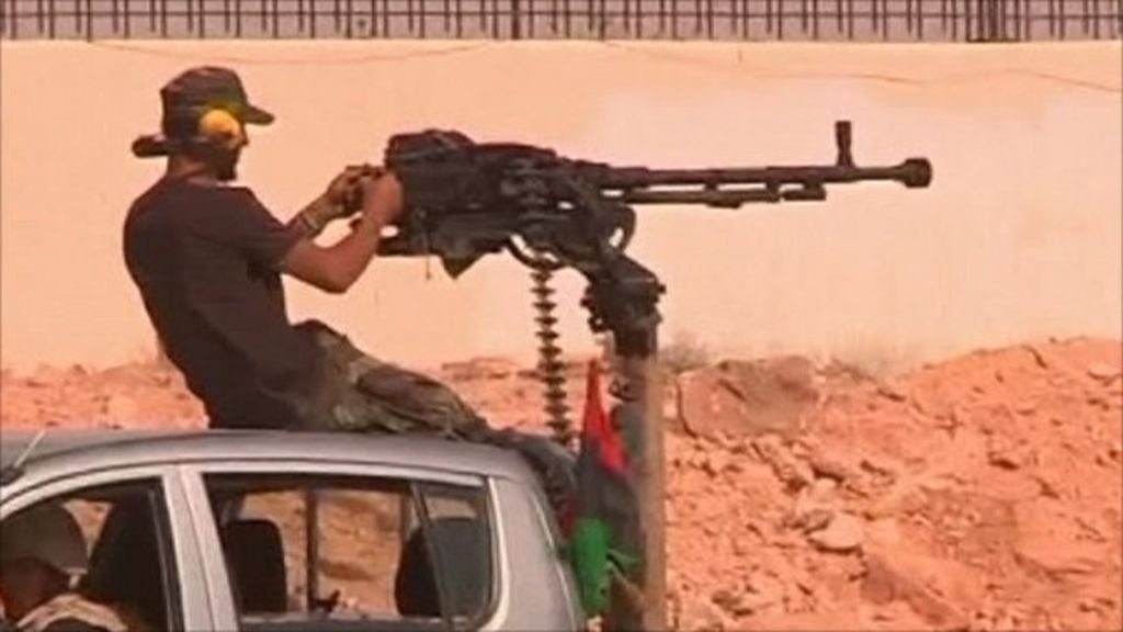 Libya: Gaddafi strongholds attacked by fighters - BBC News