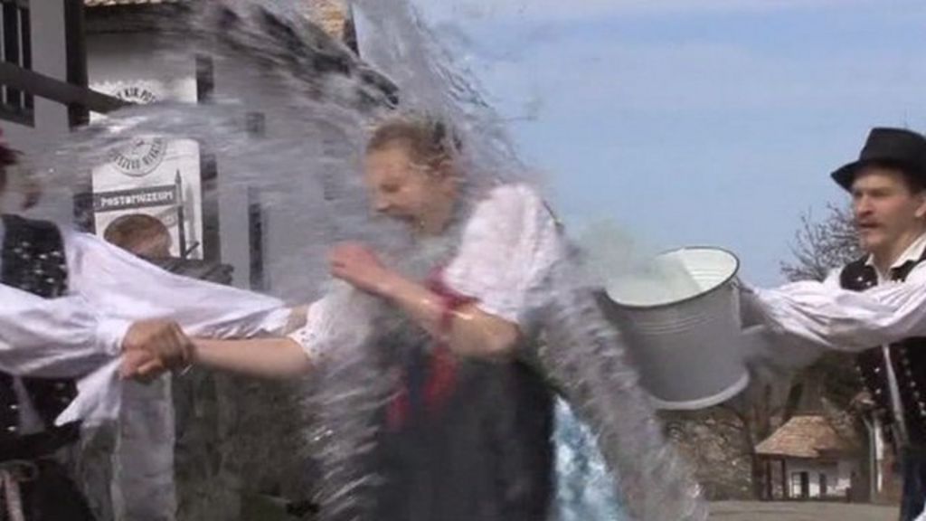 Women soaked in Hungary's annual water throwing ritual - BBC News