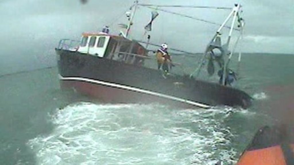 Skipper and crewman rescued from sinking Portsmouth trawler - BBC News