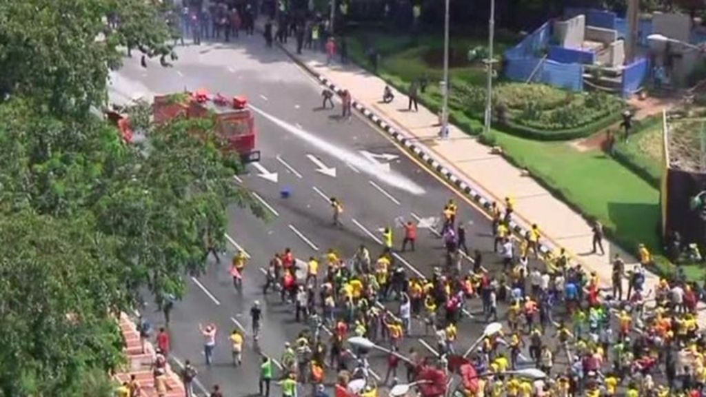 Malaysia police fire tear gas at protesters - BBC News