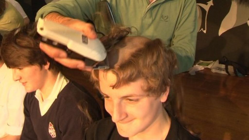 Group head shave for cancer pupil Luca Bonci - BBC News