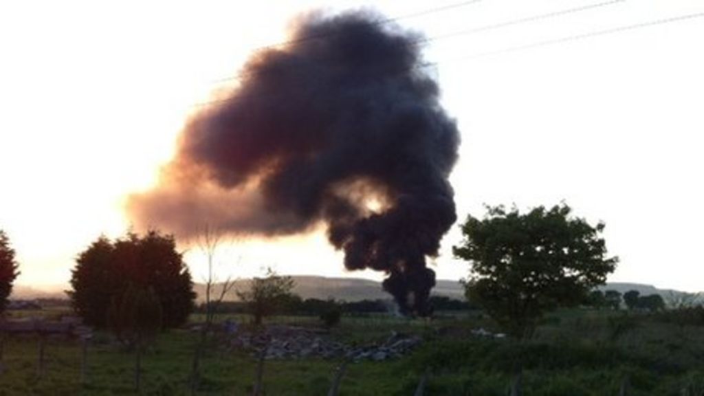 Crews tackle large portable toilet fire near Kinross - BBC News