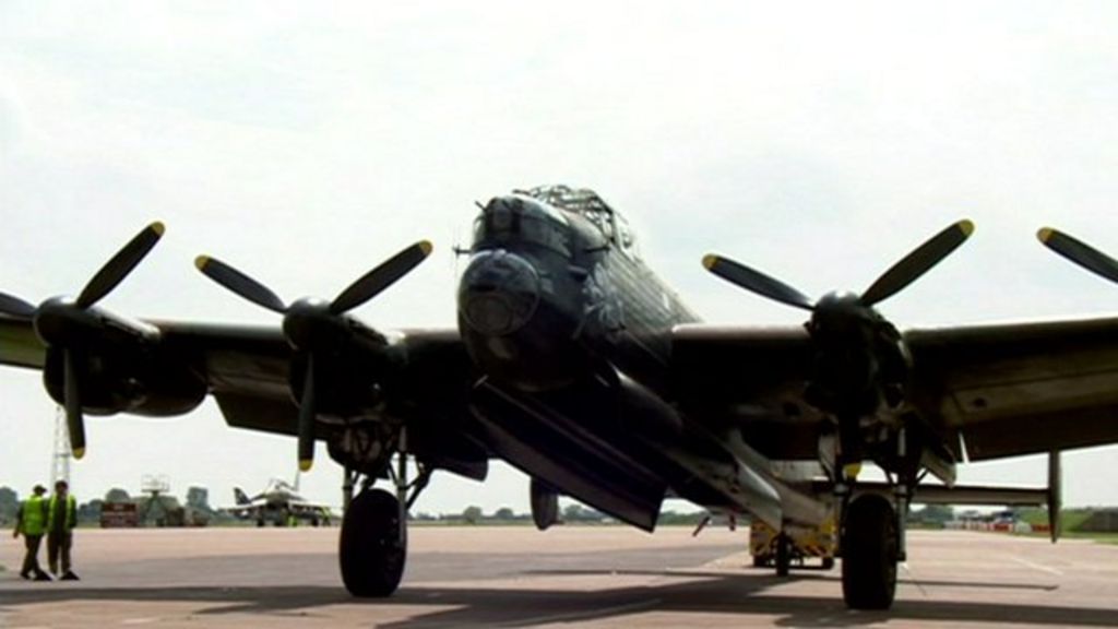 WWII Lancaster bomber takes flight for RAF celebration - BBC News