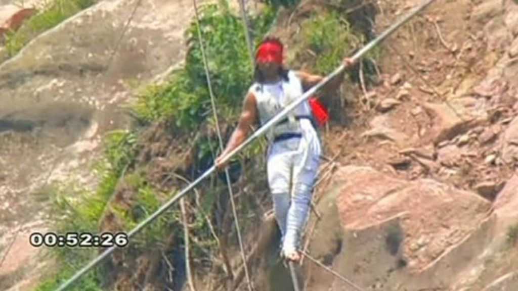 Chinese Dawa Zi acrobat 'survives high wire fall' - BBC News