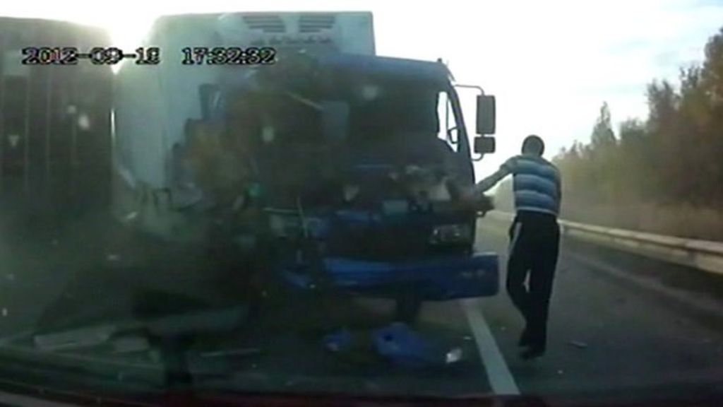 Video captures Russian lorry driver's lucky escape from crash - BBC News