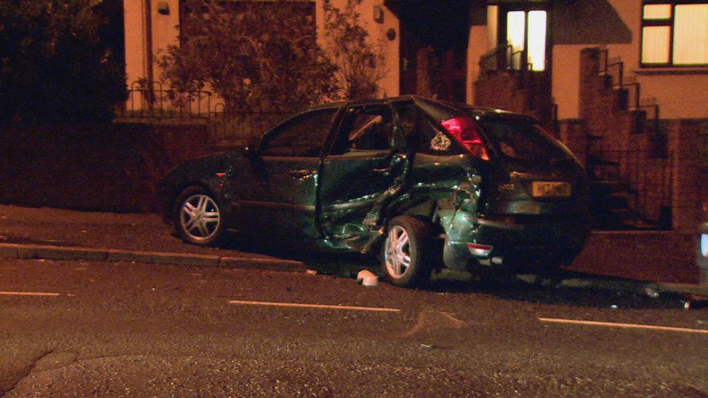Two children are hurt when a stolen car crashes in Belfast. - BBC News