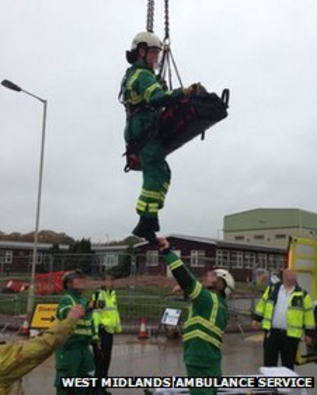 Injured builder lifted 75ft to safety by crane - BBC News