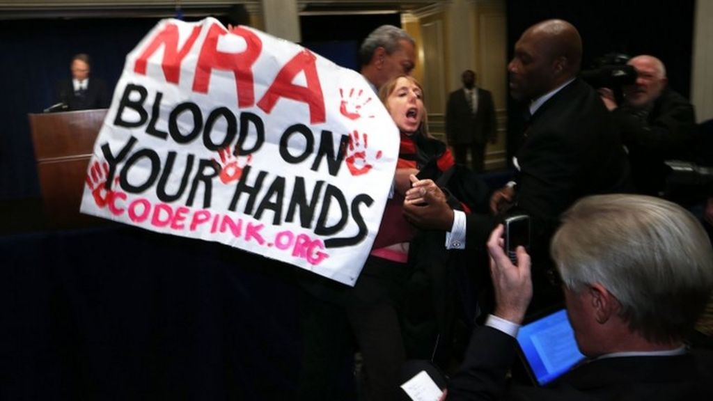 NRA news conference interrupted by protesters - BBC News