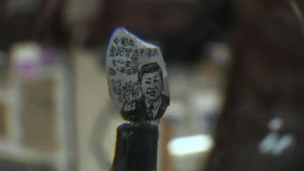 Xi Jinping portrait on grain of rice - BBC News