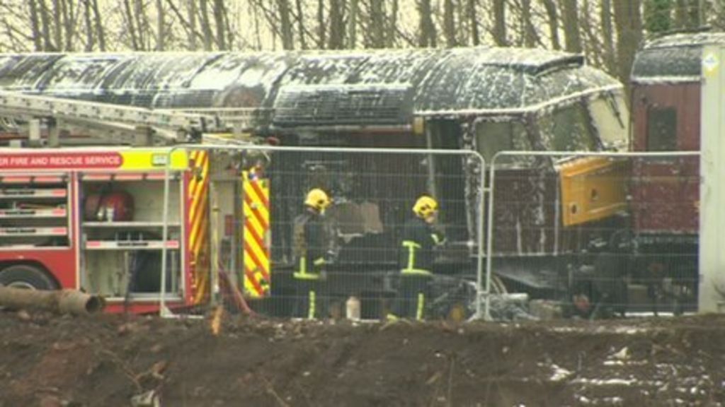 Train derails and catches fire in Salford - BBC News