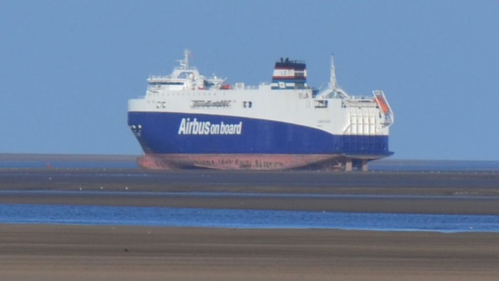 Airbus wing ship safely back in Mostyn Port after refloating - BBC News