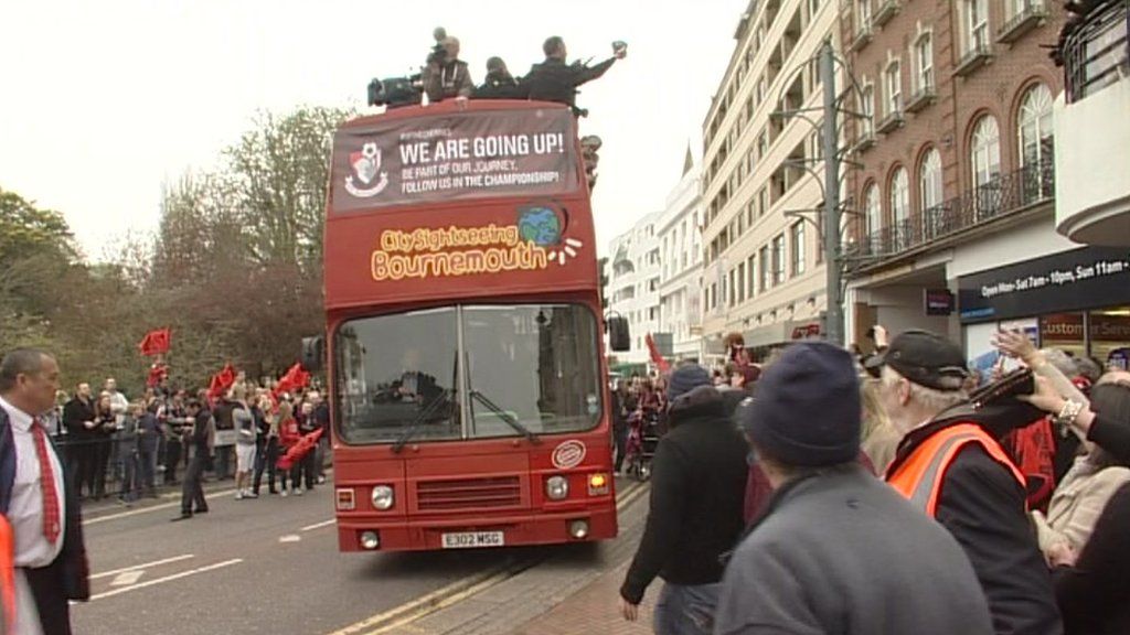 Open-top bus parade in Bournemouth celebrates promotion - BBC News