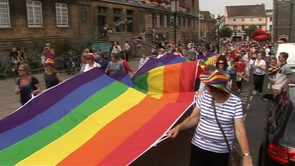 Norwich Pride parade marches through city - BBC News