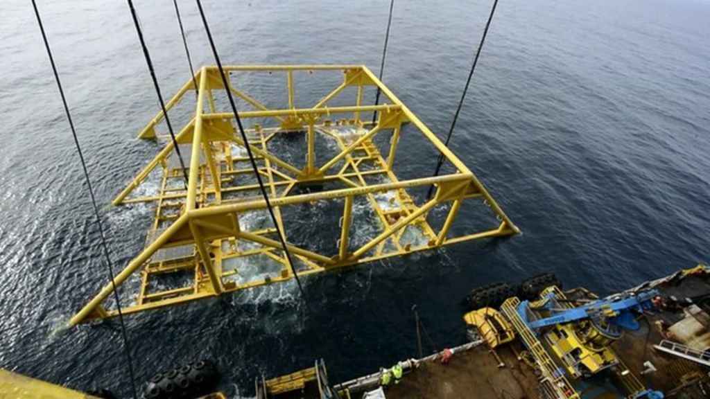 World's largest underwater machine lowered onto seabed - BBC News
