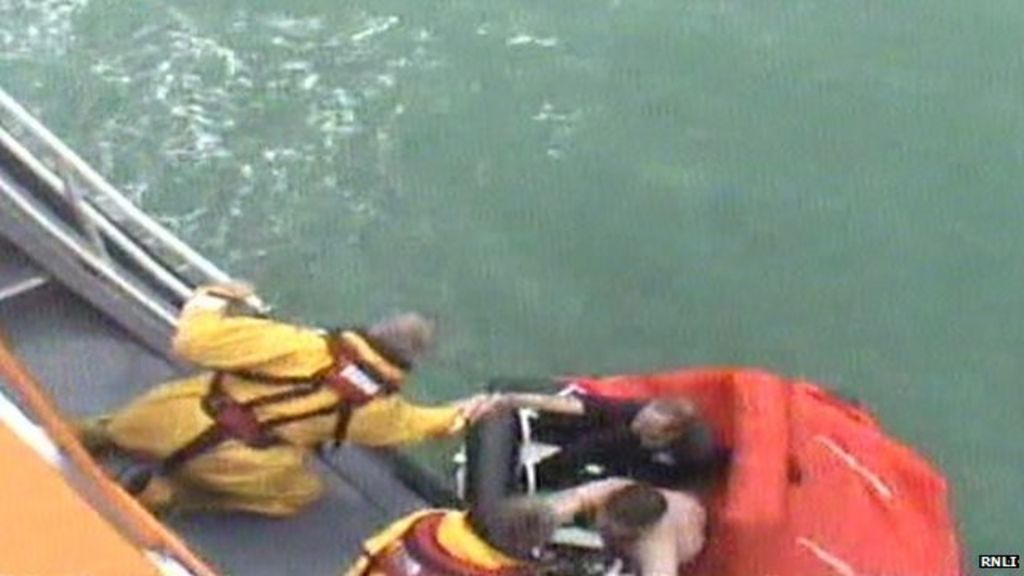 RNLI rescues fishermen after boat capsizes off Isle of Wight - BBC News