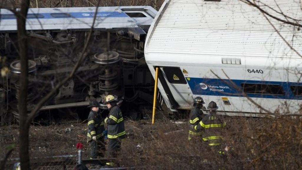 New York train crash kills four and injures dozens - BBC News