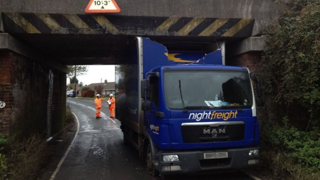 Lorry crashes into railway bridge in Bacton, Suffolk - BBC News
